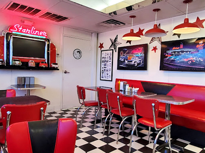 Red booths, chrome trim, and vintage art create the perfect setting for your own American Graffiti moment.