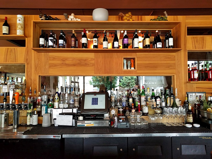 Mani's bar: where wine bottles stand at attention, ready to serve. It's like a liquid library, and every sip tells a story.