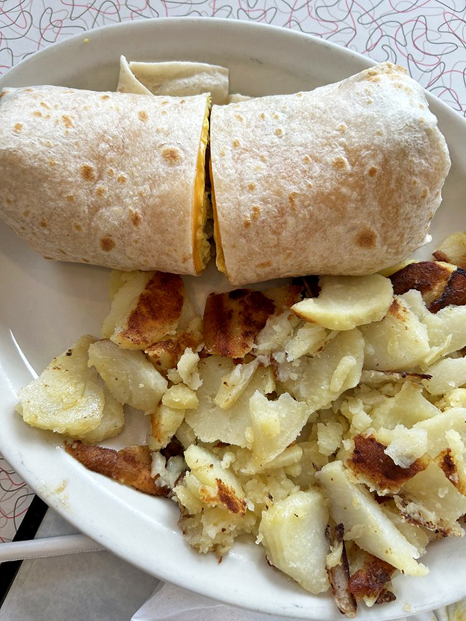 Breakfast burrito or edible hug? At Lola's, it's both. This tortilla-wrapped wonder could cure everything from hangovers to heartaches.