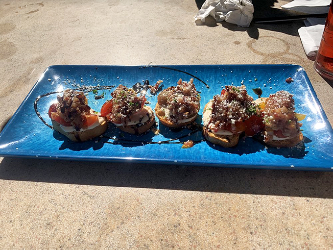 Bruschetta that's fresher than your favorite dad jokes. These little bites of joy are so good, they'll have you saying "Just one more" more times than you can count. Photo credit: Andrew C.