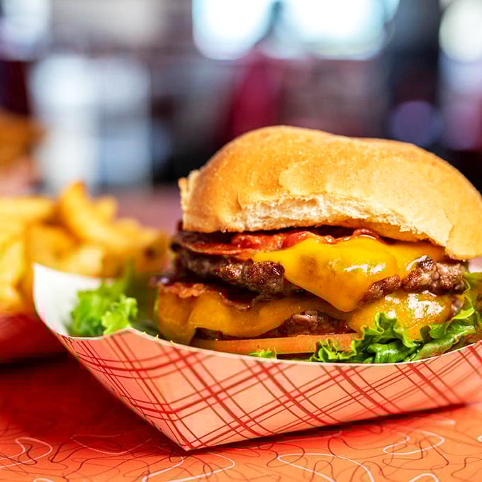 Behold, the burger of your dreams! This cheesy masterpiece is so photogenic, it could have its own Instagram account. #BurgerGoals
