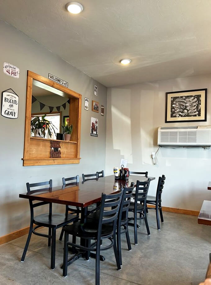 Cozy corner or flavor frontier? This dining area is where comfort food dreams come true. That 'Biscuits and Gravy' sign speaks to my soul!