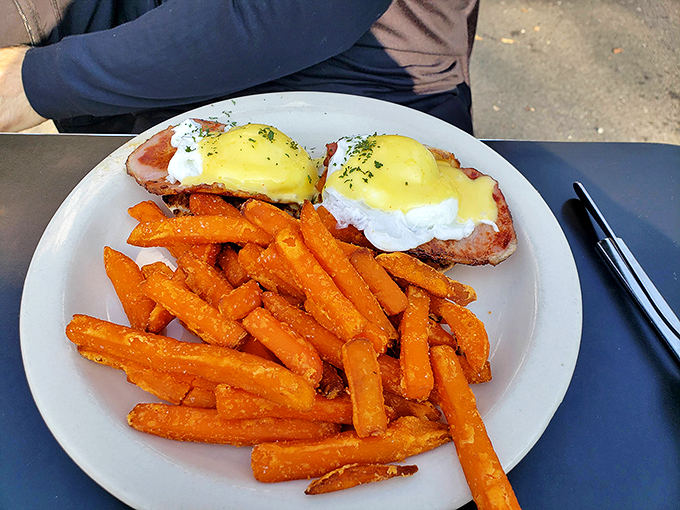 Eggs Benedict: The James Bond of breakfast foods. Sophisticated, indulgent, and always dressed to impress. Those fries? Consider them the Q-branch gadgets.