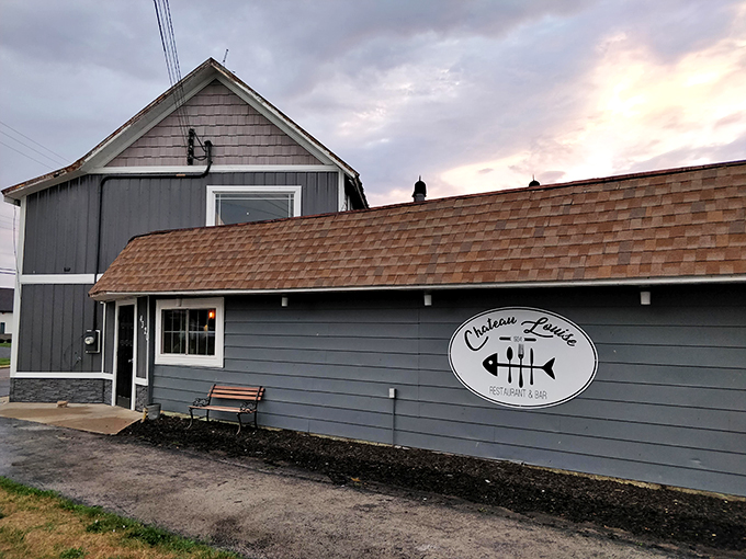 As dusk settles, this gray-sided chateau transforms into a welcoming beacon for hungry travelers and locals alike.