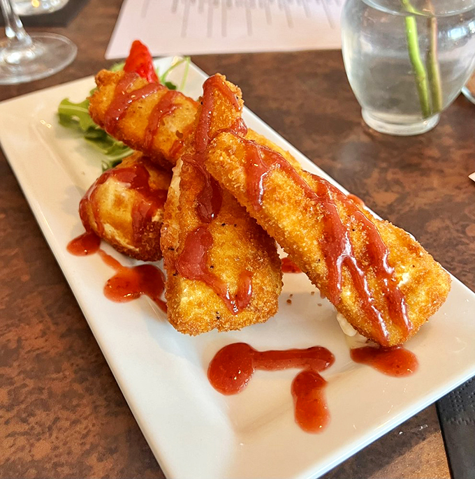 Fried cheese sticks? Please. These golden brie batons are what happens when cheese decides to dress up for the opera. Photo credit: Karen F.
