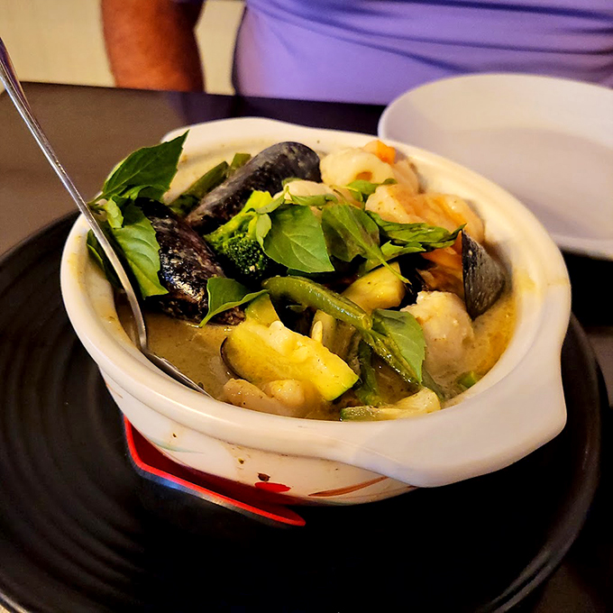 A green curry that's like a spicy, creamy treasure hunt. Each spoonful is a new adventure for your palate.