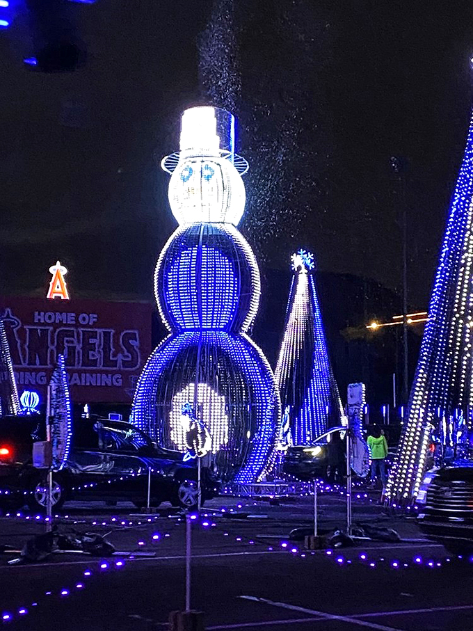 Is it a snowman or a lighthouse? Either way, this towering fellow is guiding us through a sea of holiday cheer!