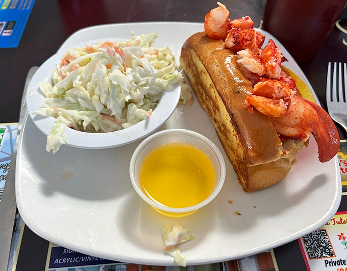 A classic New England treat gets a Florida makeover, served with fresh coleslaw and enough lobster to make Maine jealous.