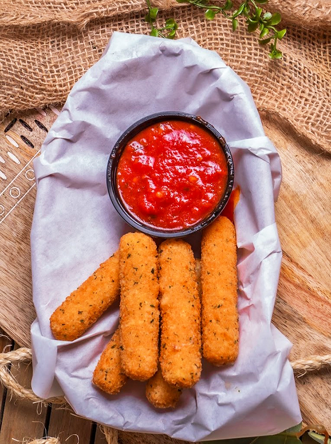 Crispy on the outside, gooey on the inside. These mozzarella sticks are like edible magic wands.
