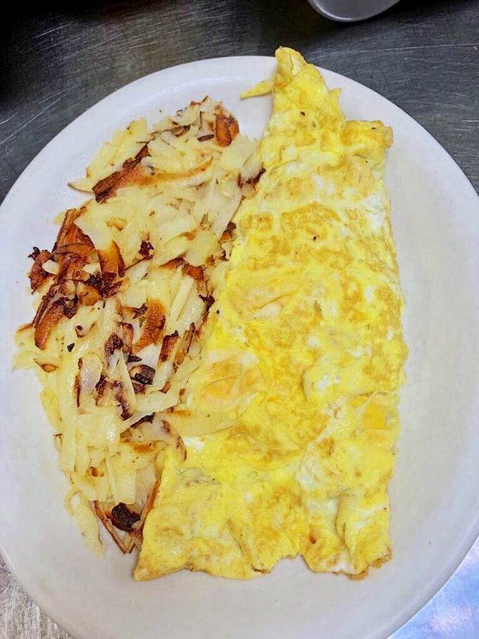 The dynamic duo of breakfast: a fluffy omelet and crispy hash browns. It's like Batman and Robin, but for your taste buds.