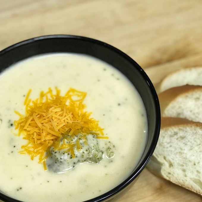 Comfort in a bowl. This creamy soup, topped with a blanket of cheese, is like a warm hug for your taste buds on a chilly day.