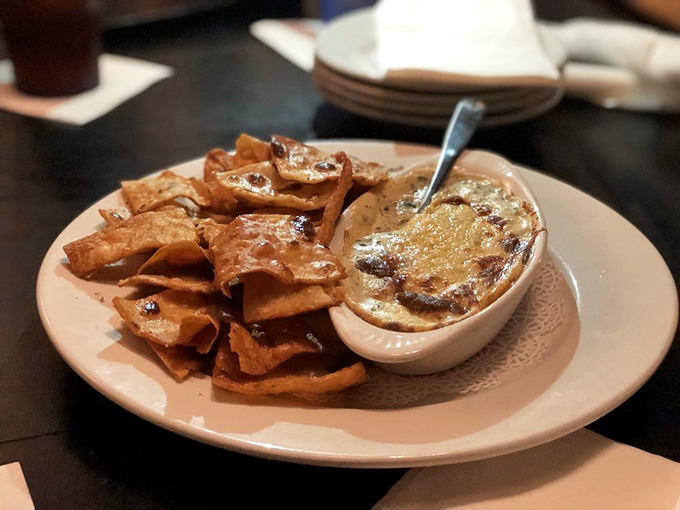 Spinach dip that Popeye would approve of. Creamy, cheesy, and served with crispy chips &ndash; it's the perfect start to your Irish culinary adventure. Photo credit: Bobby B.