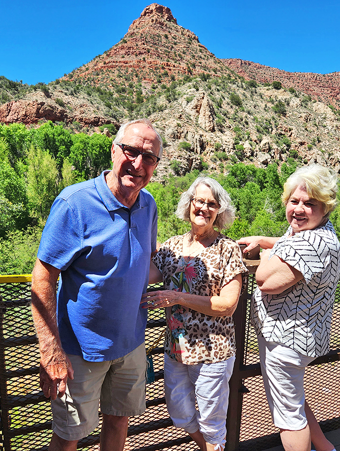 Happy travelers soaking in the sights! These folks look like they've discovered the secret to time travel – and it involves comfy shoes and big smiles.
