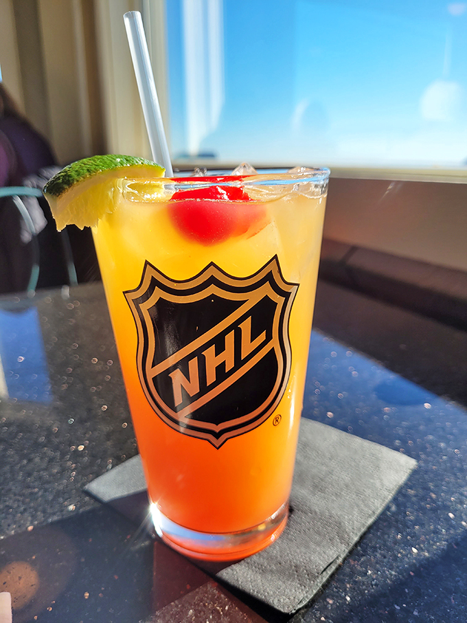 This sunny cocktail is like a vacation in a glass. NHL logo included &ndash; because nothing says 'refreshing' like ice hockey, right?
