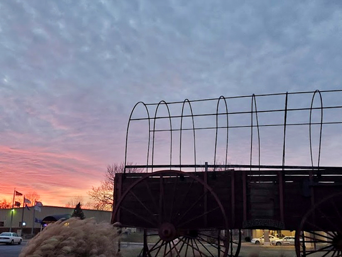 "When Mother Nature decides to upstage a giant wagon." This breathtaking sunset proves that sometimes, the best special effects are courtesy of the great outdoors.