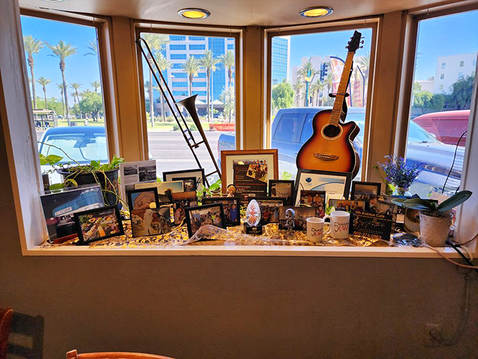 A window into the soul of 5th Avenue Cafe! This display of memories and music is like a scrapbook come to life, telling the story of a beloved local institution. Photo credit: Mike B.