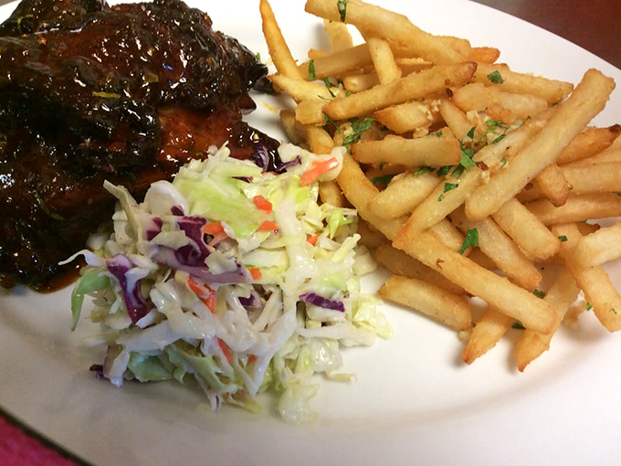 These ribs aren't just fall-off-the-bone tender. They're practically leaping onto your fork! Paired with crisp slaw and golden fries, it's a plate of pure Midwest magic.