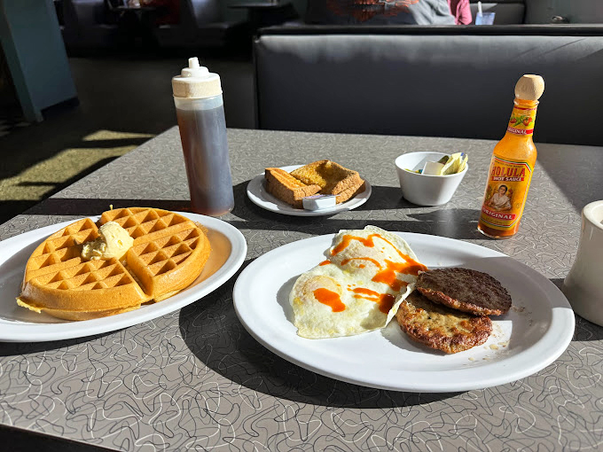A proper diner spread that answers the eternal question: "Why choose between waffles and eggs?"
