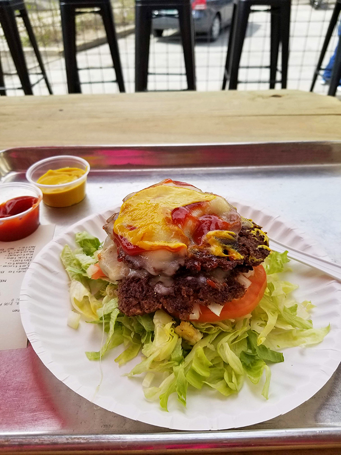 Who needs a bun when your burger comes dressed like this? A garden-fresh feast atop perfectly seasoned beef.