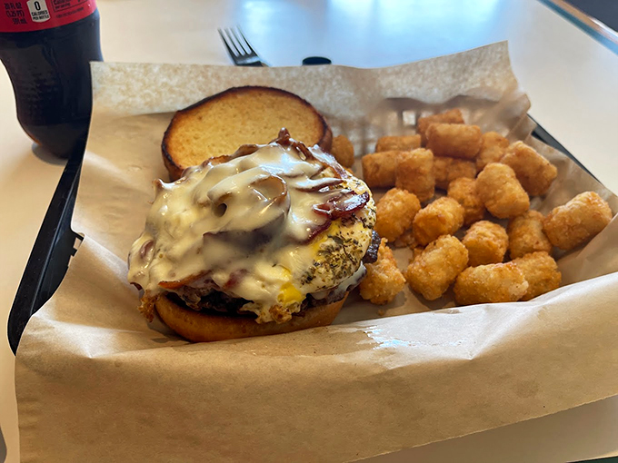 Melted cheese drapes over this burger like a warm blanket on a cold Maine morning. Pure comfort on a bun.