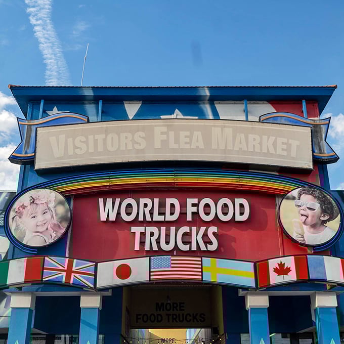 Feast your eyes on this kaleidoscope of commerce! From flags to food trucks, this entrance is your portal to a world of whimsical wonders.
