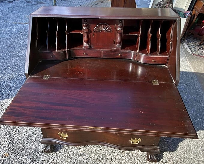 Writer's block, meet your match! This vintage desk has more nooks and crannies than an English muffin, perfect for hiding your unfinished novel.