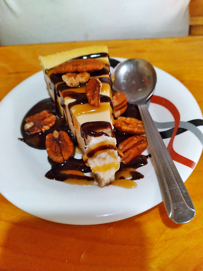 Sweet endings! This dessert is a pecan-topped slice of heaven, drizzled with pure indulgence.