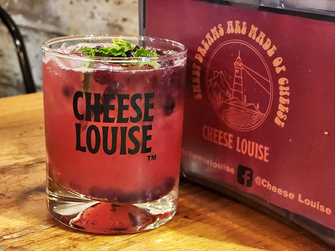 Ruby-red cocktails in branded glasses prove Cheese Louise knows how to pour on the charm. Photo credit: Chamnann Ok