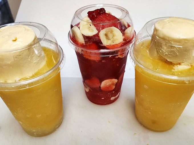 A rainbow of refreshment: yellow sunshine and ruby red drinks garnished with fresh fruit slices. Photo credit: Freddy Castro
