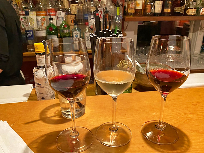 Wine glasses lined up like elegant soldiers, ready to complement whatever culinary adventure you choose.