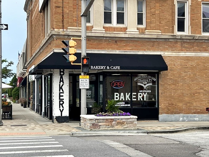 The corner bakery stands proud against the Illinois sky, its awning a beacon for carb enthusiasts and coffee lovers alike.