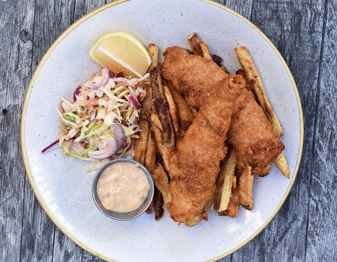 Golden-battered fish with a side of perfectly crisp fries - Neptune himself would approve of this catch.