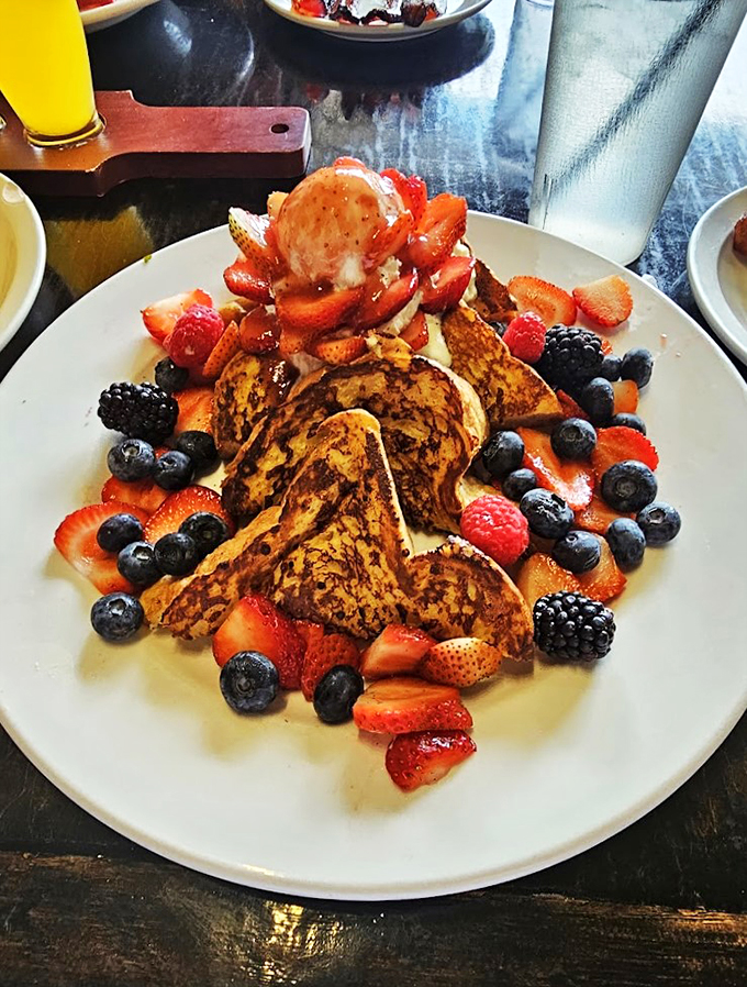 A berry explosion on French toast island. It's a breakfast that's not afraid to show its wild side!