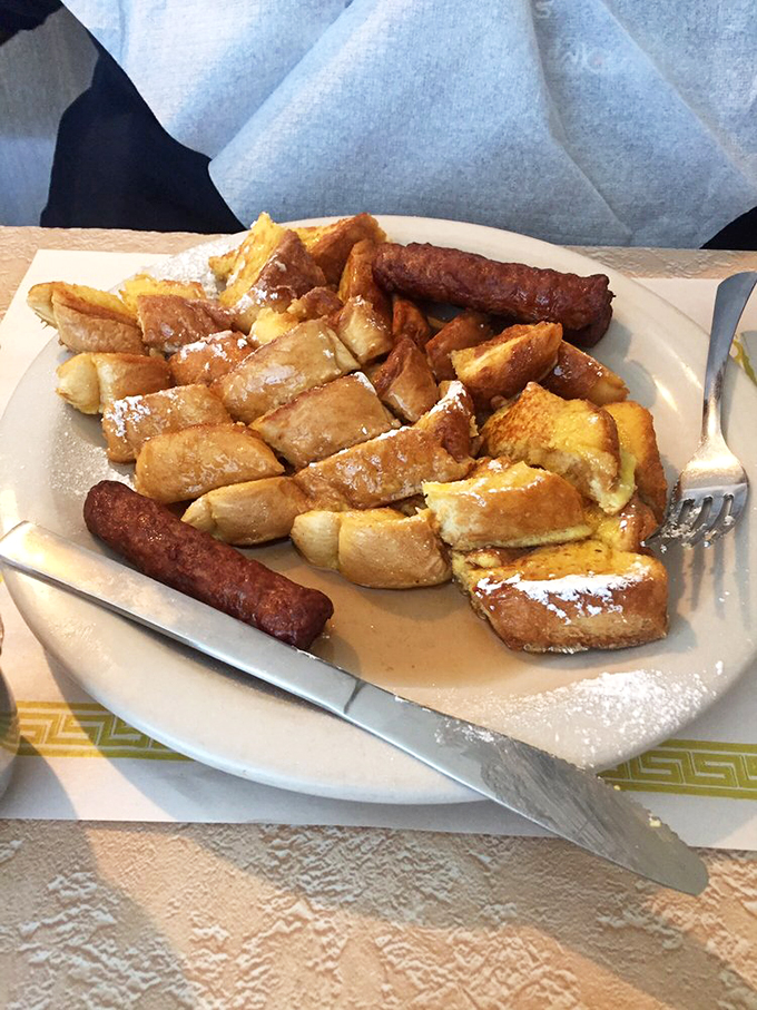 French toast so golden, it could make Fort Knox jealous. Paired with sausages that mean serious breakfast business.