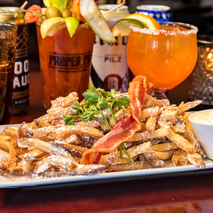 These aren't just fries - they're bacon-dusted works of art that deserve their own gallery showing.