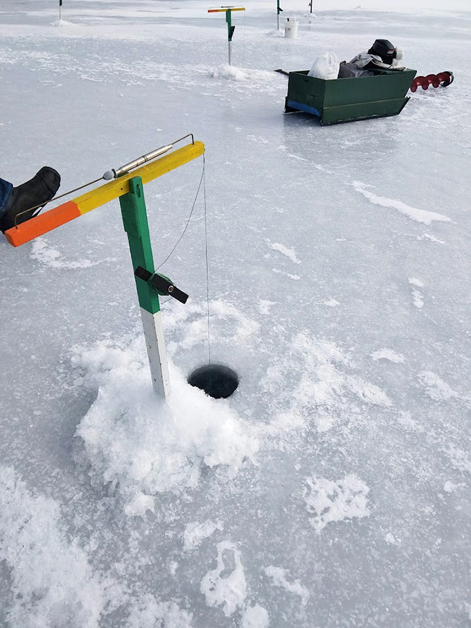 Frozen feast prep: When the lake turns to ice, the real die-hards come out to play. It's like ice skating, but with the promise of dinner.