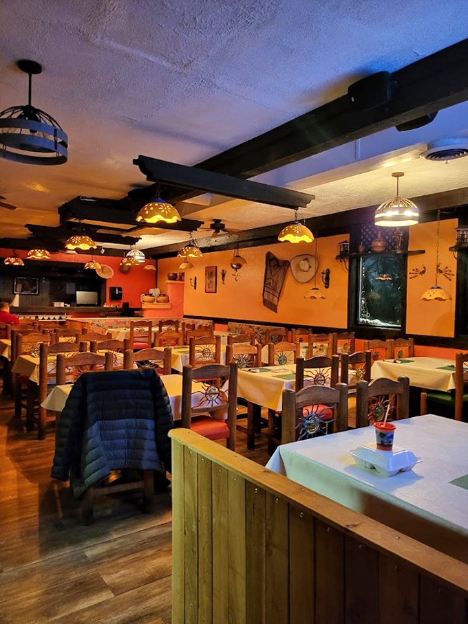 Custom wooden chairs and warm lighting transform dinner into an intimate experience that feels worlds away from Illinois.