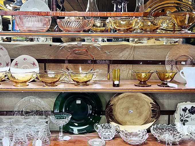 Amber depression glass catches the light like liquid honey, while vintage plates wait to grace new dinner tables.