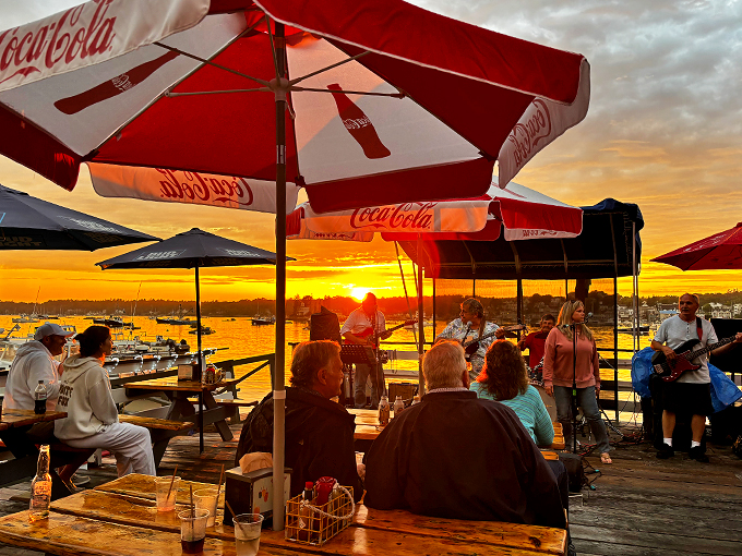 Sunset serenade with a side of seafood. Nothing says "Maine summer" quite like live music and the gentle clinking of lobster claws in the background.