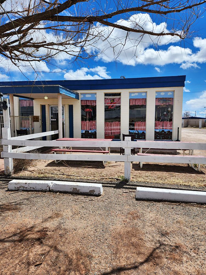 Simple white fencing and picnic tables invite you to enjoy your slice under Arizona's brilliant blue skies. 