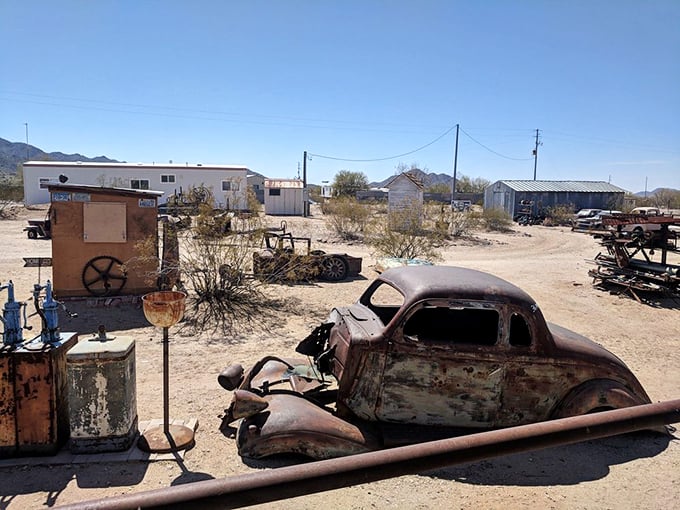 Welcome to the Dwarf Car boneyard, where rusty dreams come to be reborn. It's like Mad Max meets Antiques Roadshow in the heart of the desert.