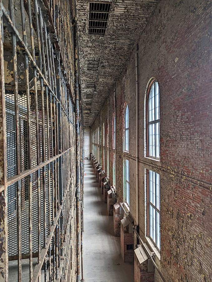 Sunlight streams through barred windows, painting hope on cold stone walls. A poetic glimpse into Shawshank's world.