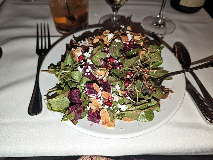 A garden party on a plate, where crisp greens dance with tangy cheese and crunchy nuts. Photo credit: William de Figueiredo