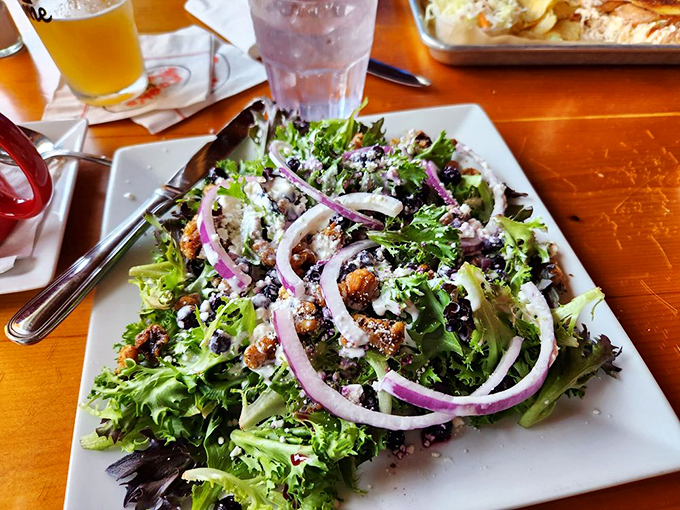 A fresh garden party with candied walnuts and red onions dancing through crisp greens - because balance is beautiful.