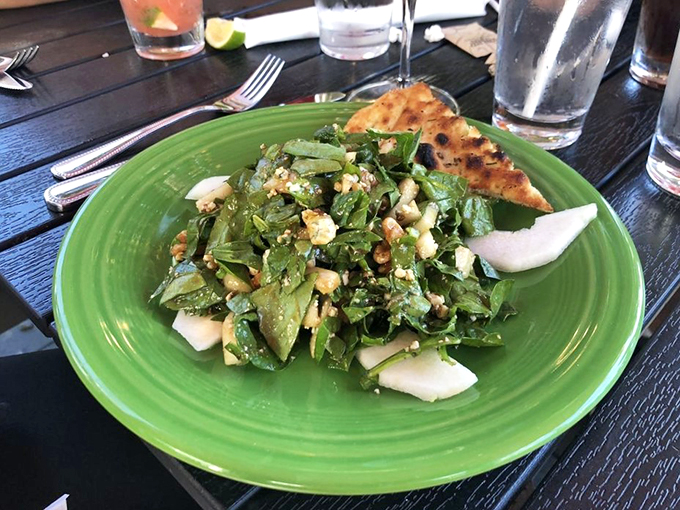 Fresh greens playing nicely with pear slices and what appears to be blue cheese. A sophisticated lunch date.