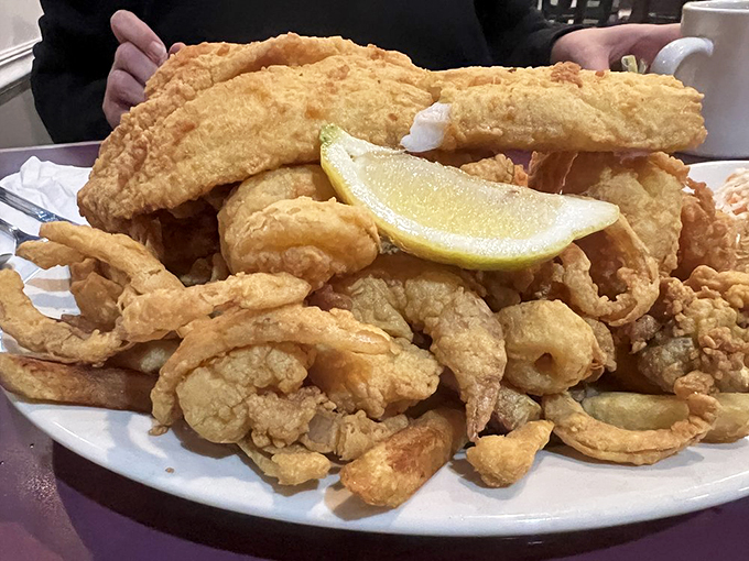A golden mountain of fried seafood that makes you wonder if Neptune himself is in the kitchen.