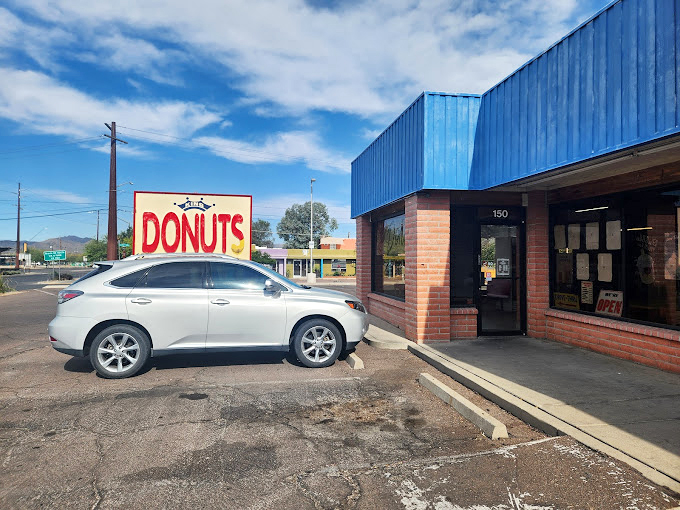 Where brick meets blue, this corner of donut paradise welcomes early birds and afternoon treat-seekers alike.