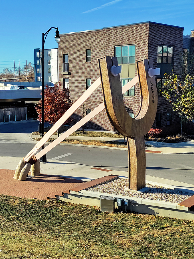 Sun's out, fun's out! On a clear day, this slingshot isn't just an artwork&mdash;it's a beacon of joy in a sea of brick and mortar.