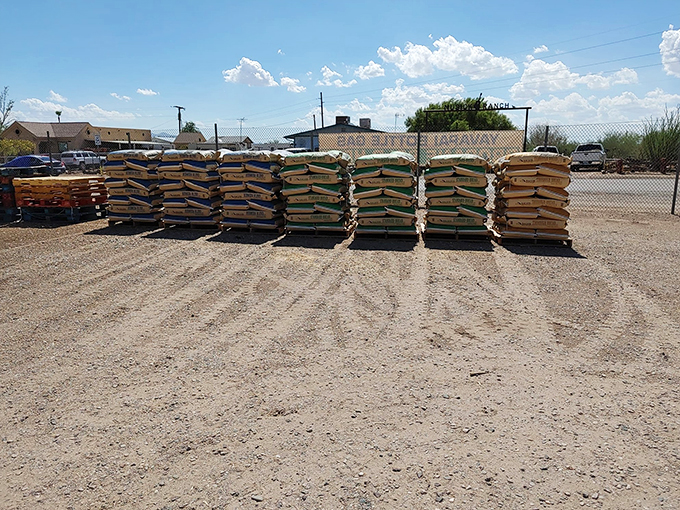 Stacked higher than a cowboy's tall tale! These pallets of goods are a testament to Wells Country Store's commitment to keeping the community well-stocked.