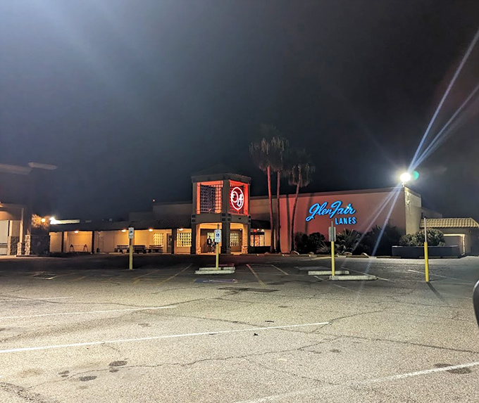 As night falls, the neon sign becomes a beacon for fun-seekers, glowing against the Arizona sky.